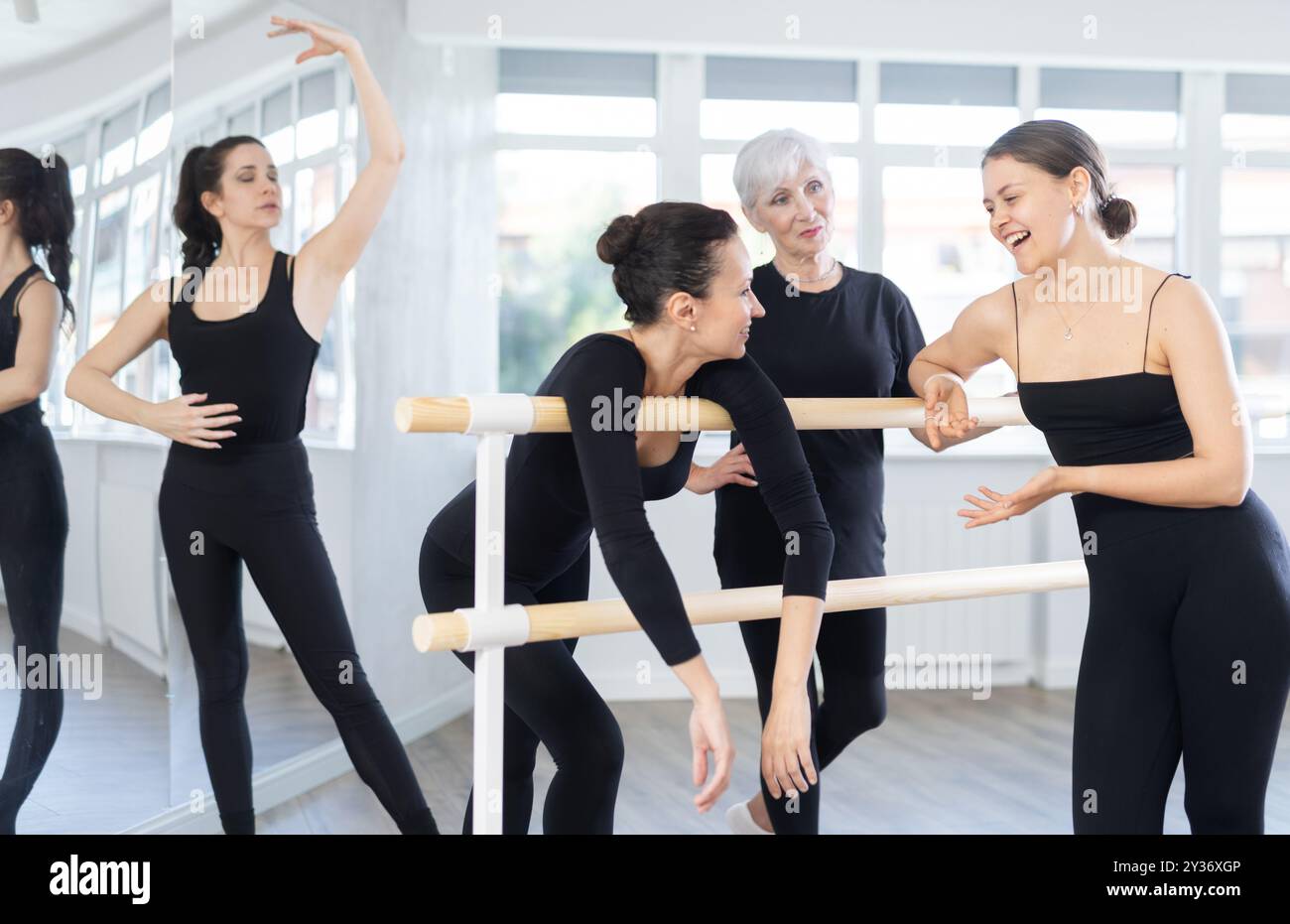 Group of women talking during dance training Stock Photo - Alamy