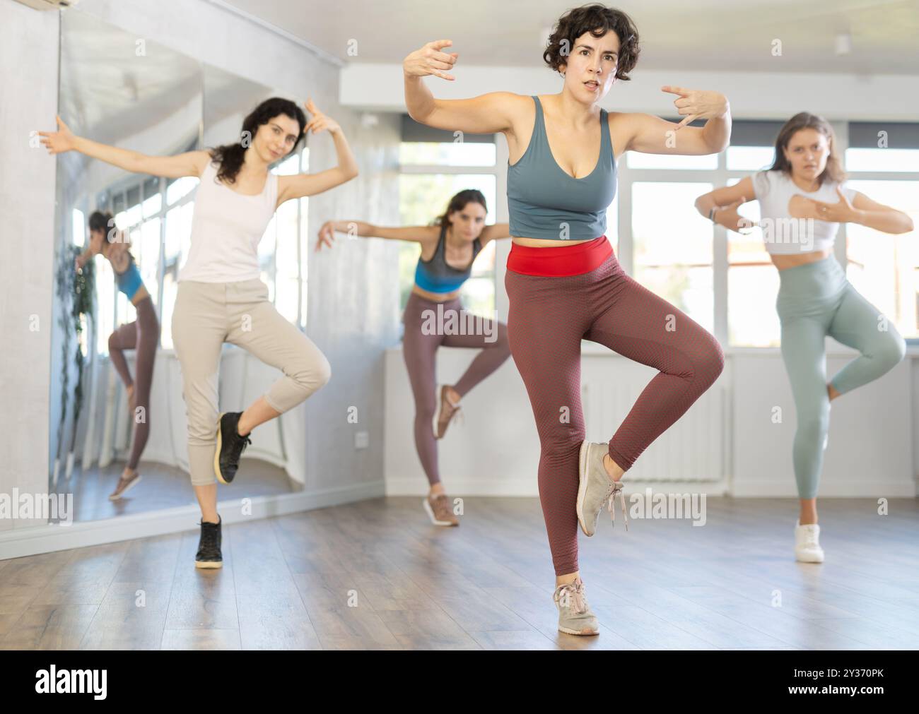 Female teacher conducts modern dance lessons for group of girls Stock ...