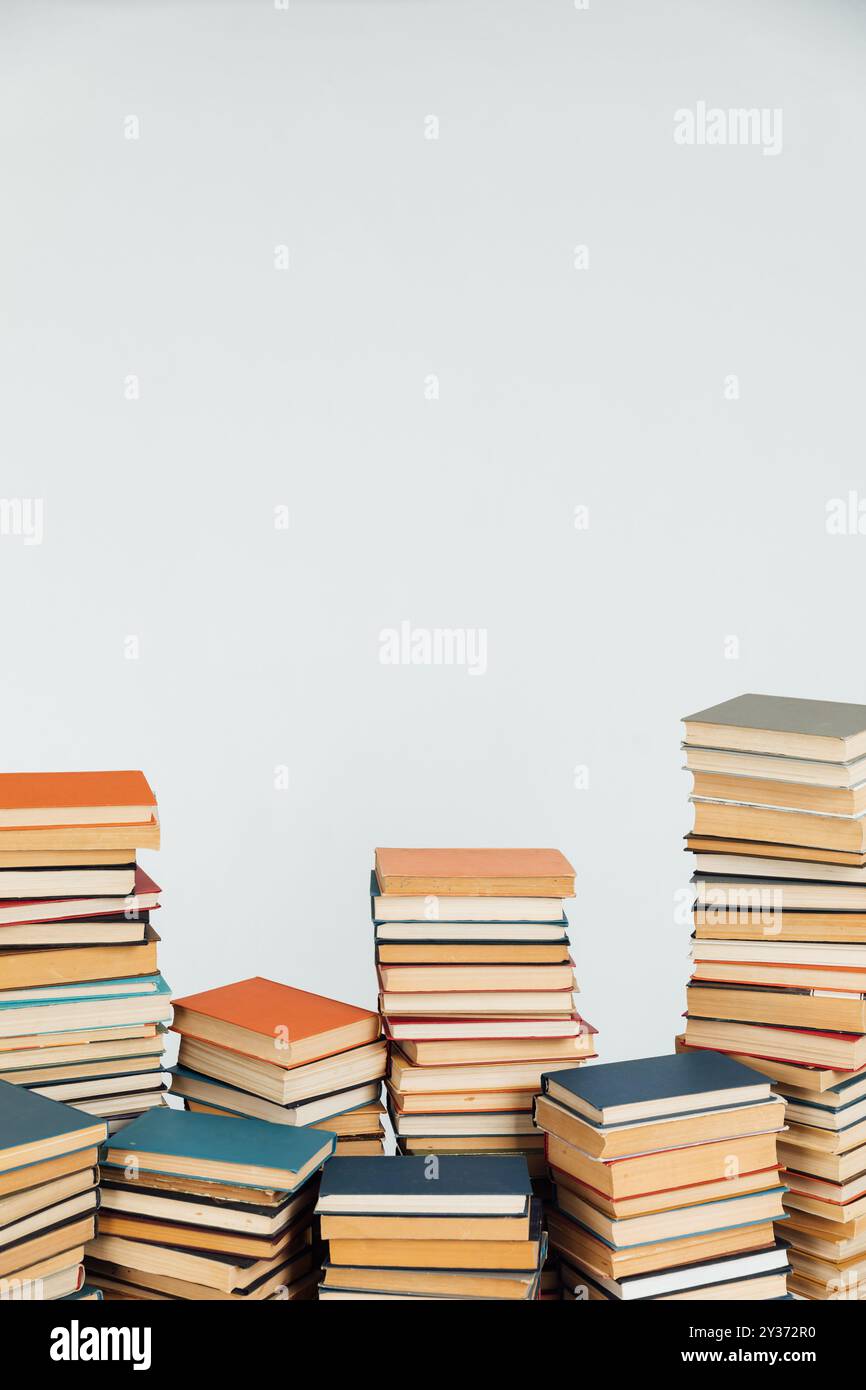 lots of old stacks of books on a white background of the library Stock ...