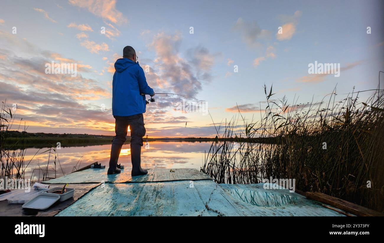 fisherman fishing on shore of Corrib river, Galway, Ireland, spinning ...
