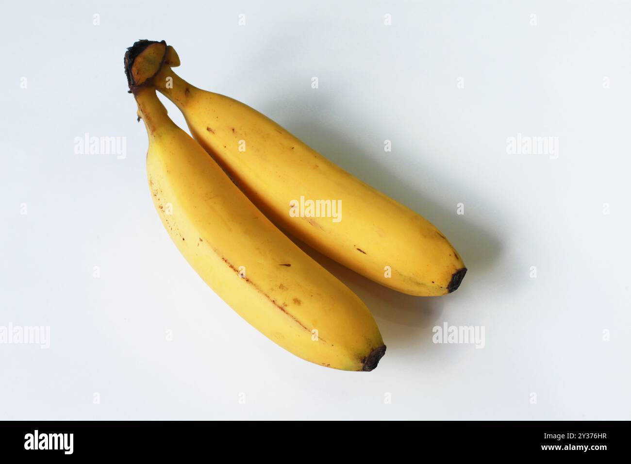 Two bananas isolated on white background Stock Photo - Alamy