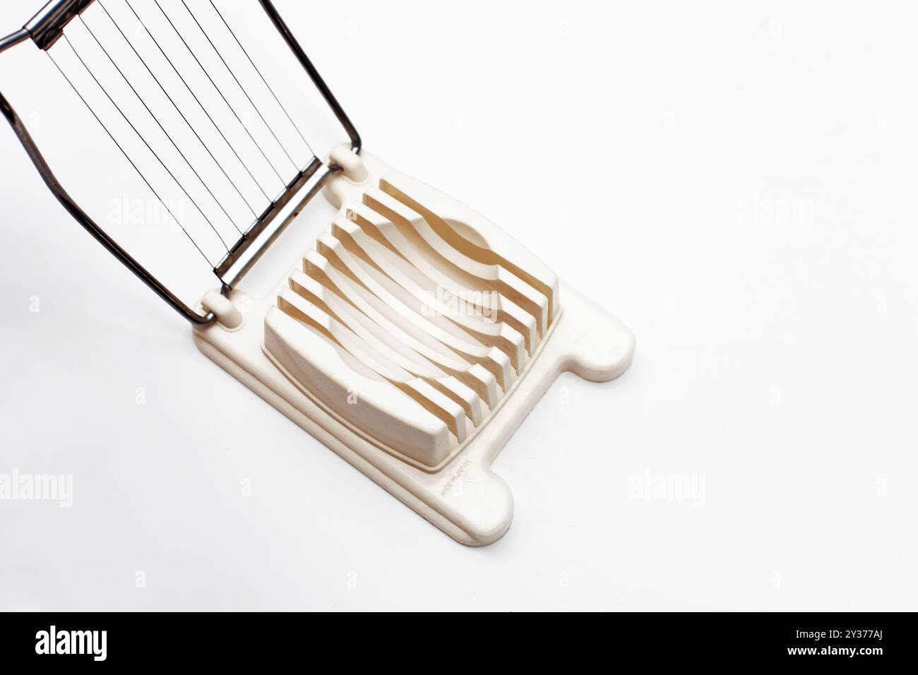 Egg Slicer kitchen utensil on white background Stock Photo - Alamy