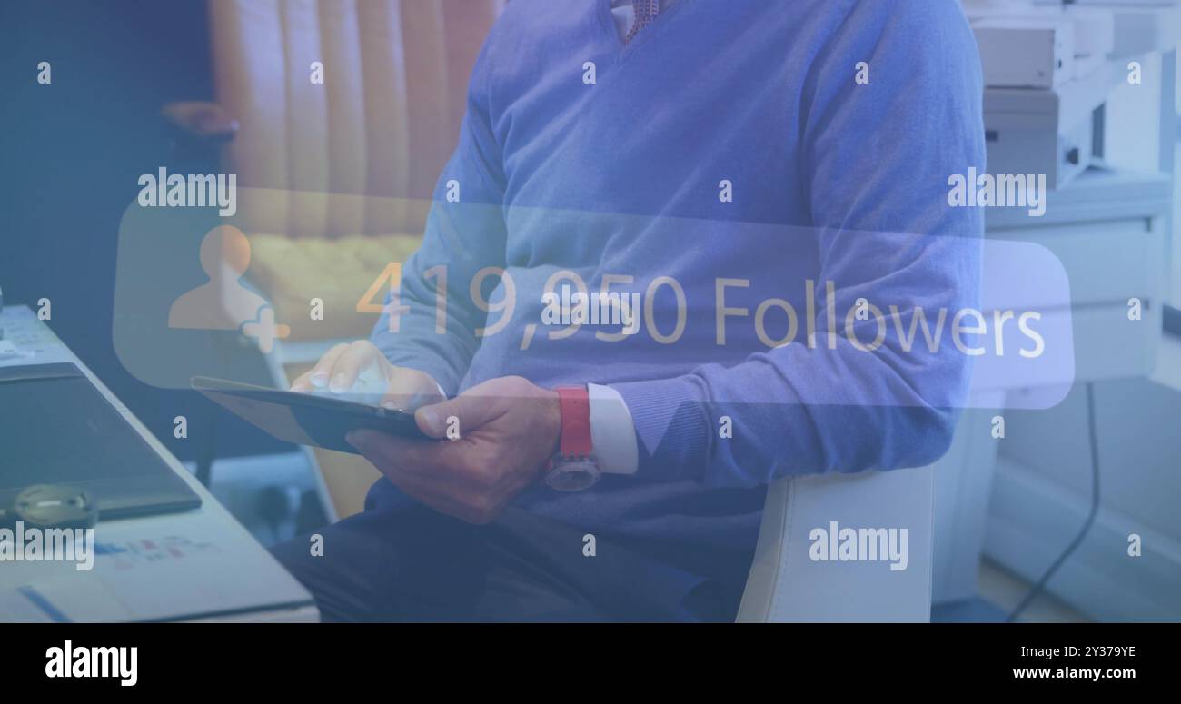 Using tablet, person gaining followers image over office background ...