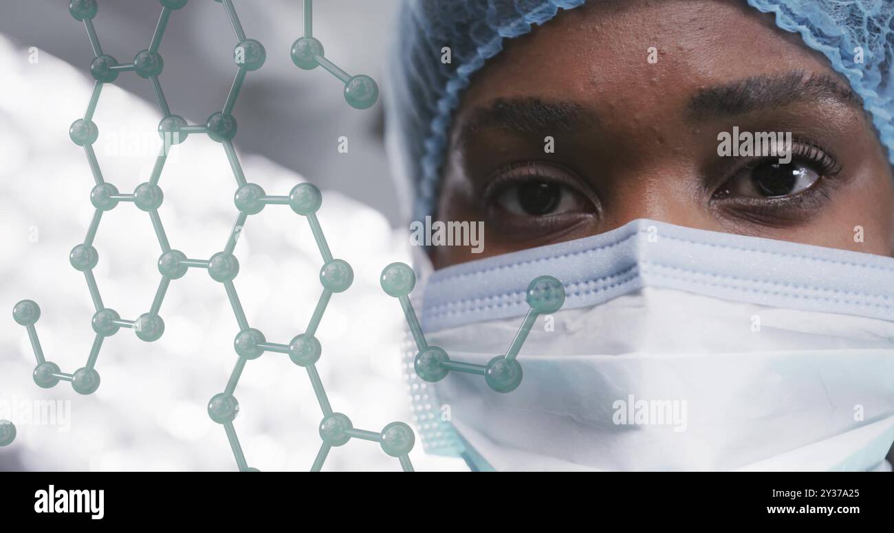 Image of element structure over african american female surgeon in cap ... Image of element structure over african american female surgeon in cap ...