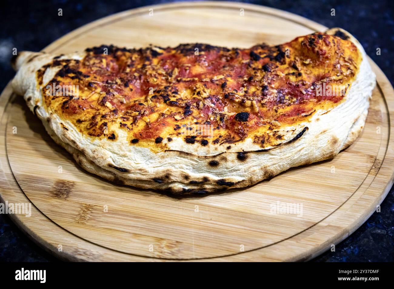 Traditional artisanal calzone made with long-matured dough stuffed with ...