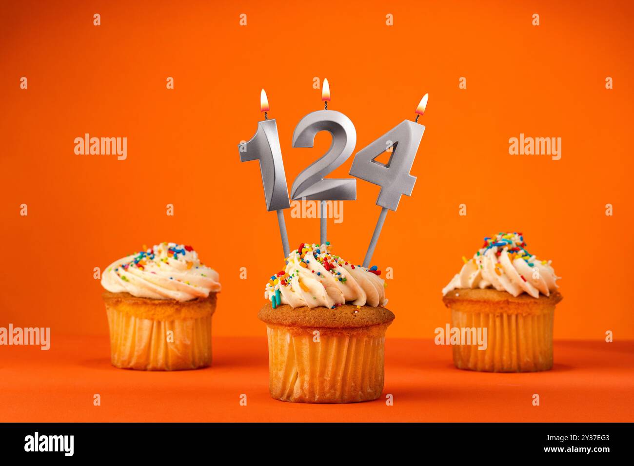 Birthday celebration in orange color - Candle number 124 Stock Photo ...