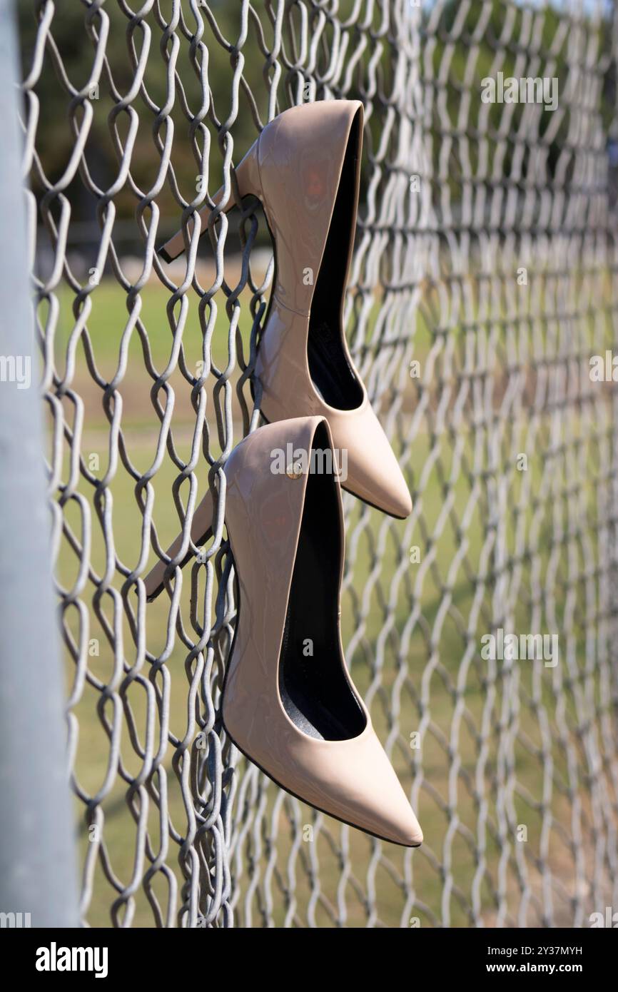 Shoes on chain fence hi-res stock photography and images - Alamy