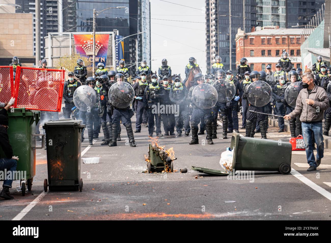 A bin seen melting after the demonstrators set it on fire, behind a ...