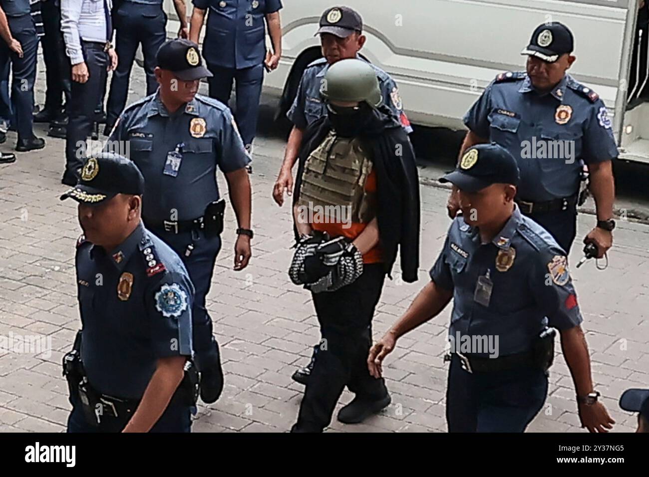Apollo Carreon Quiboloy, wearing a helmet and flak jacket, a Filipino ...