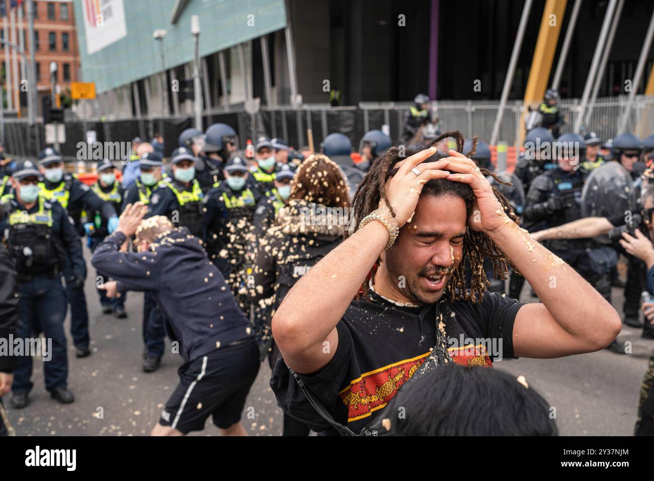 A demonstrator feels the instantaneous effects of pepper spray during ...