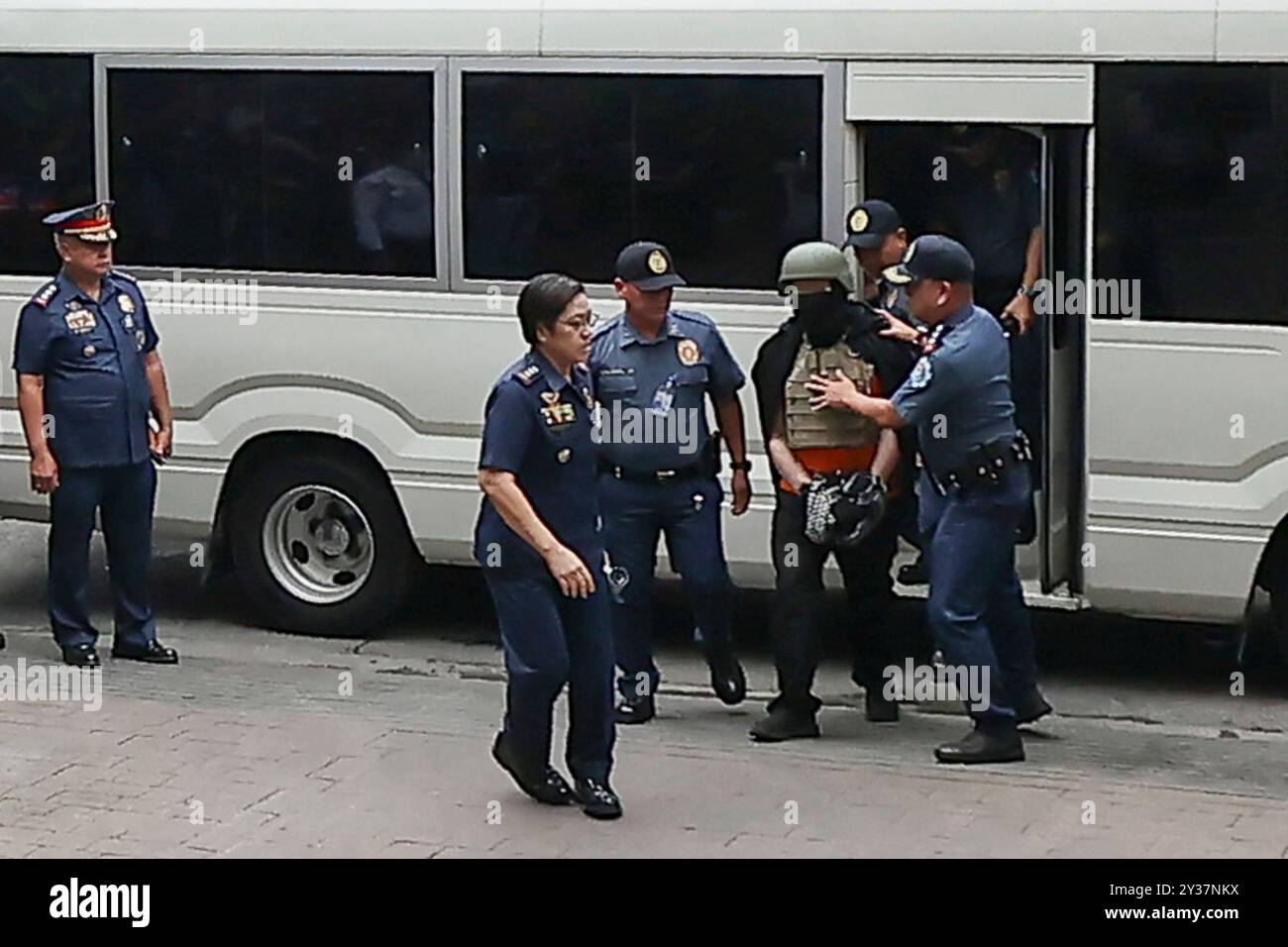 Apollo Carreon Quiboloy, wearing a helmet and flak jacket, a Filipino ...
