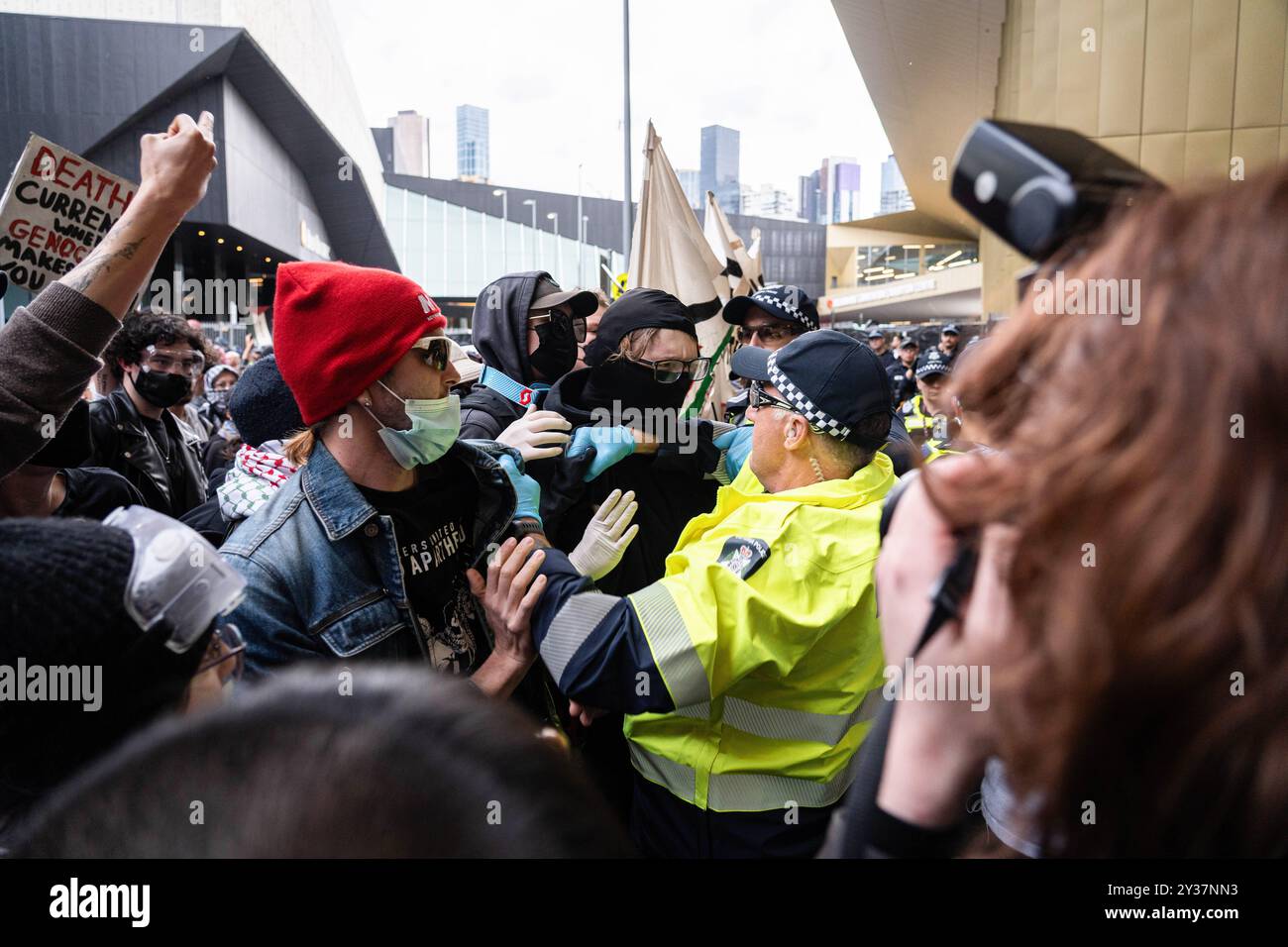Police officer seen holding back a protester as he launches at him ...