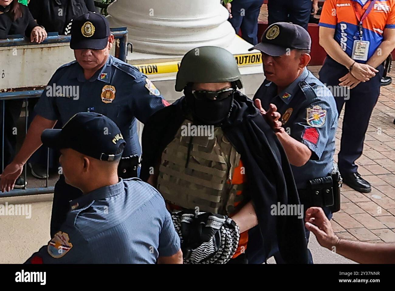 Apollo Carreon Quiboloy, wearing a helmet and flak jacket, a Filipino ...