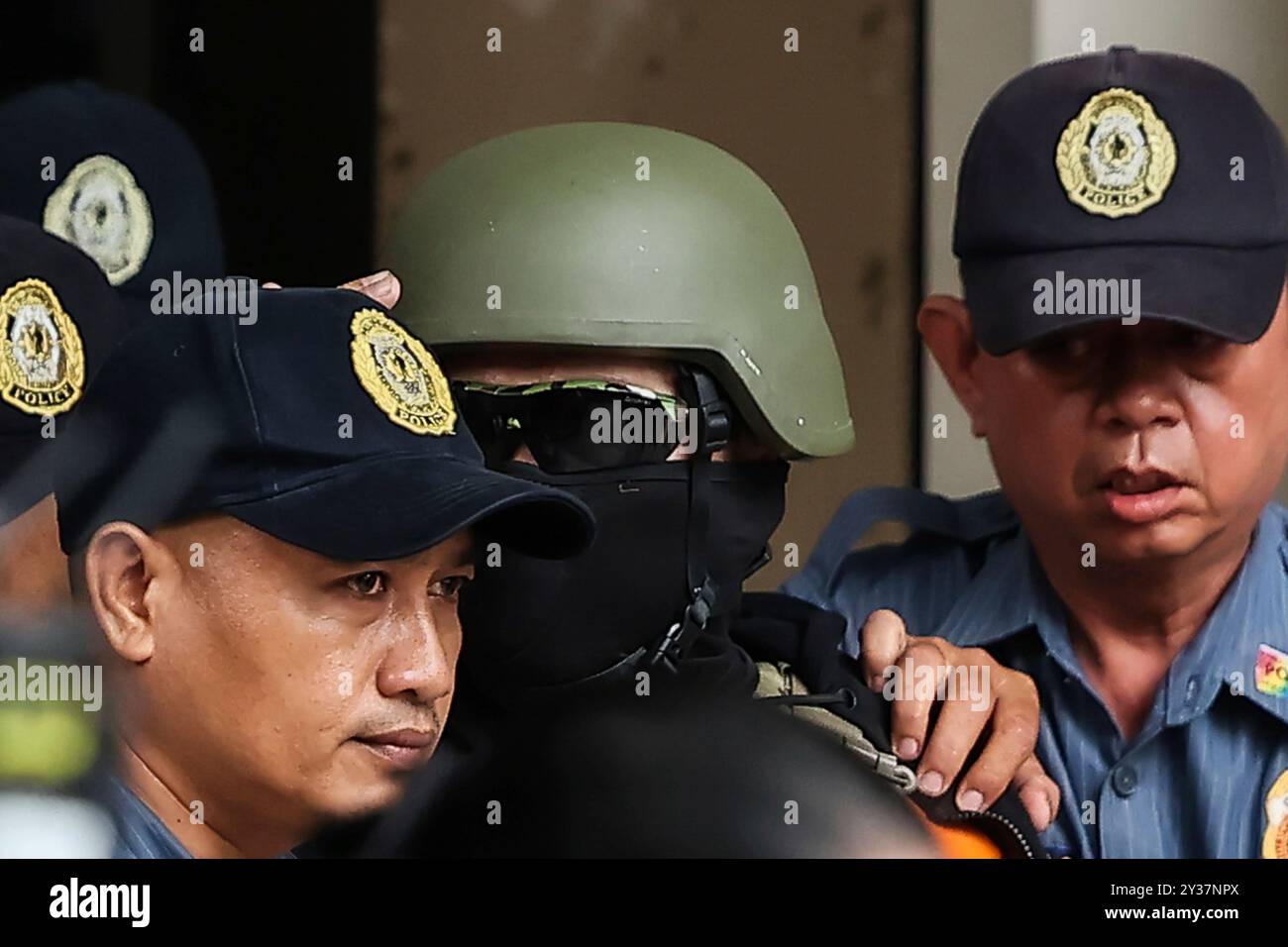 Apollo Carreon Quiboloy, wearing a helmet and flak jacket, a Filipino ...