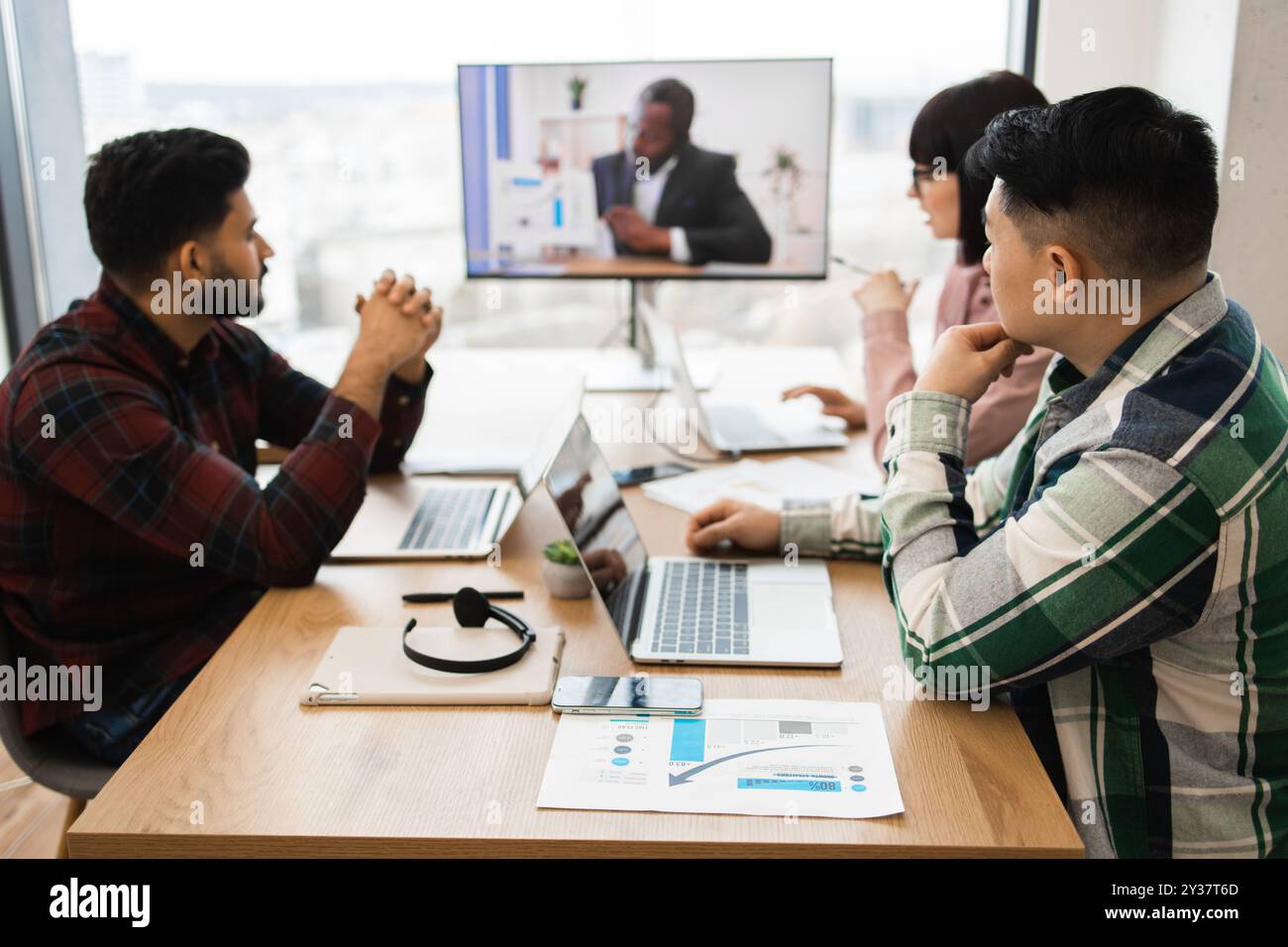 Team video conference with three employees in office meeting room Stock ...