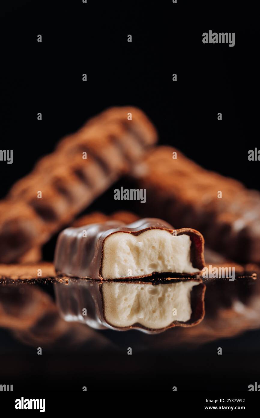Chocolate bar with creamy filling on dark background, ideal for dessert ...