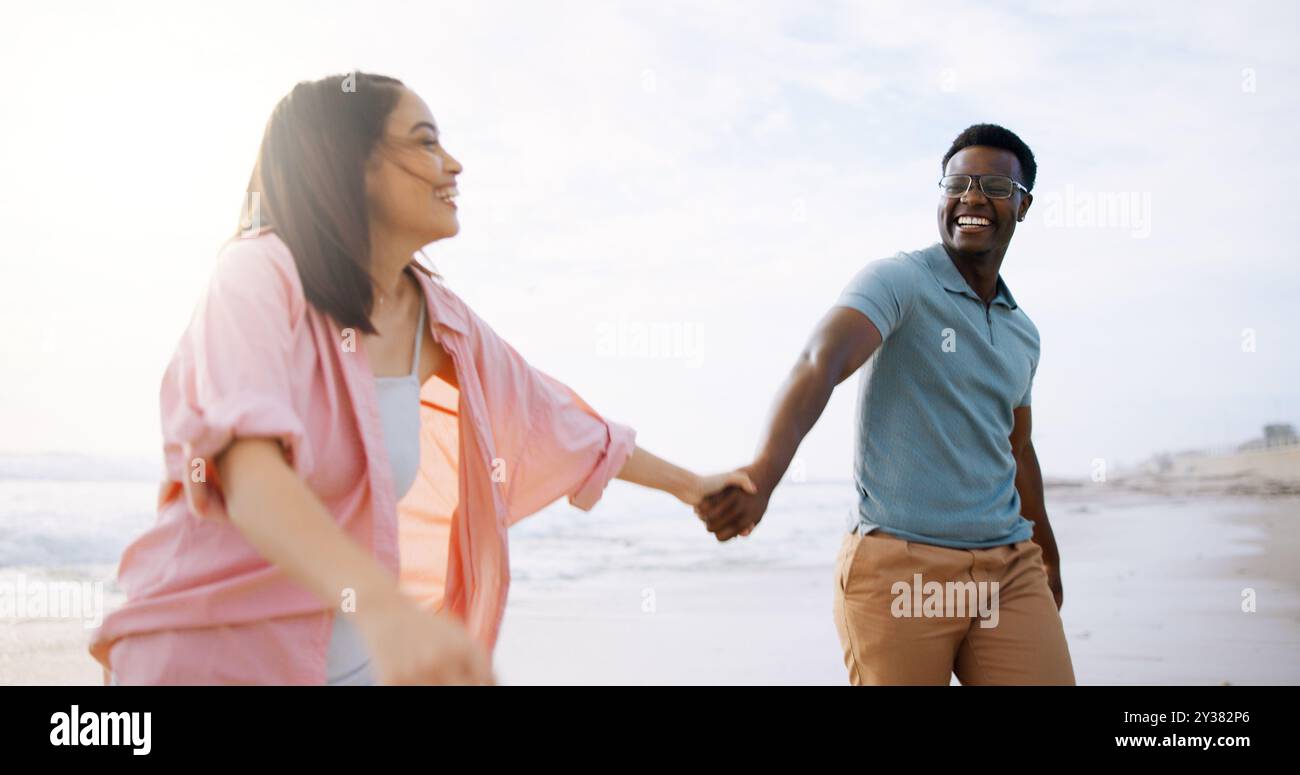 Happy, holding hands and walk with interracial couple at beach for ...