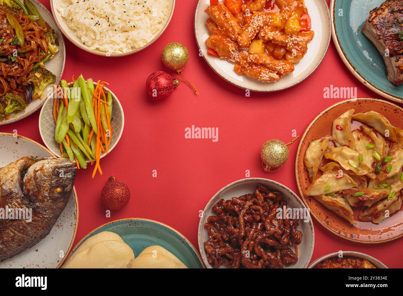 Chinese new year festive table with traditional dishes top view on red ...