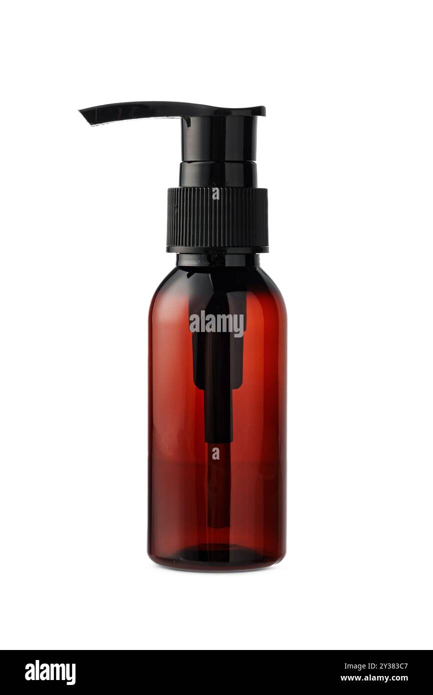 Amber glass pump bottle for skincare products on a simple white ...