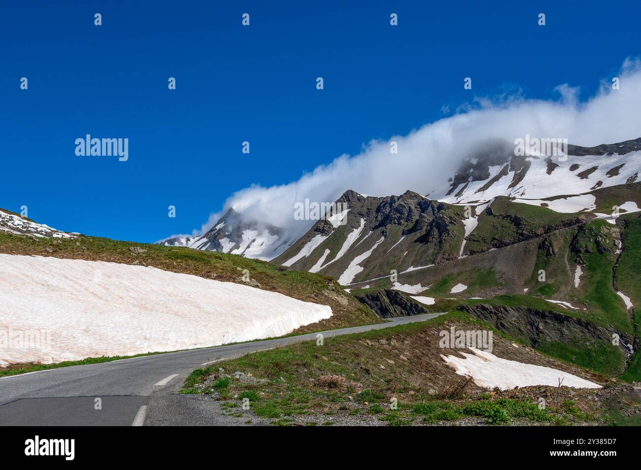 The mountain pass road D902 to the Col du Galibier, separating the ...