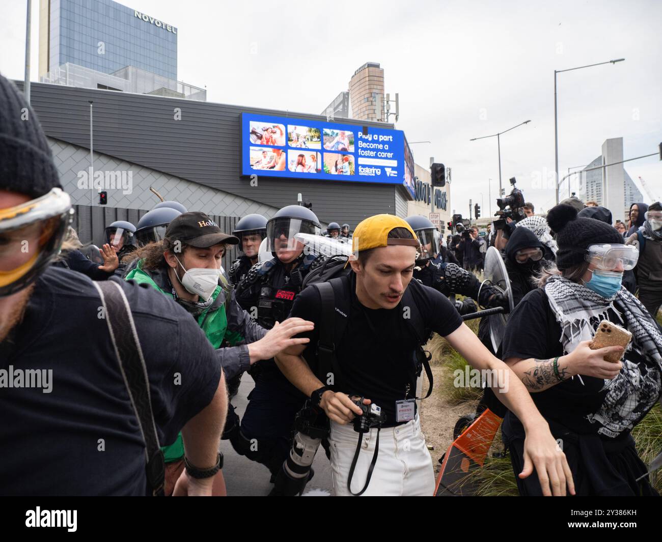 Melbourne, Australia. 11th Sep, 2024. Demonstrators and media flee an ...