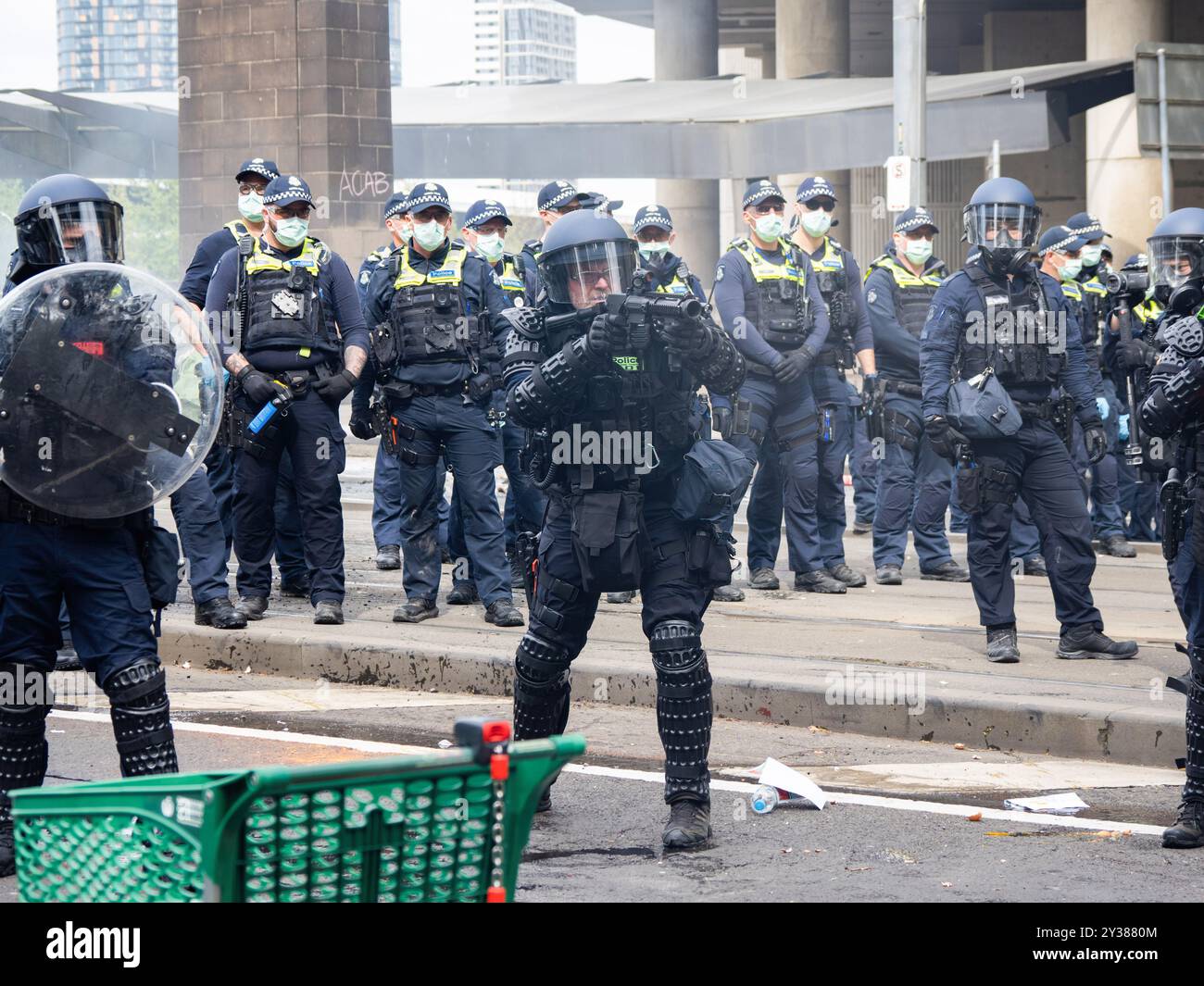 A Victoria Police Public Order Response Team officer is seen with a ...