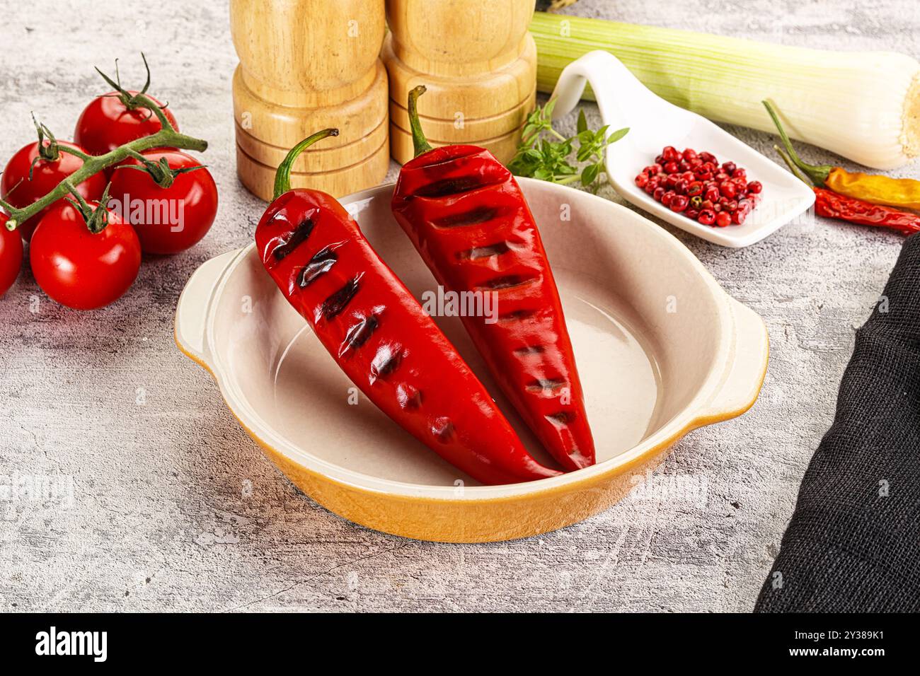 Grilled red spicy pepper snack in the bowl Stock Photo - Alamy