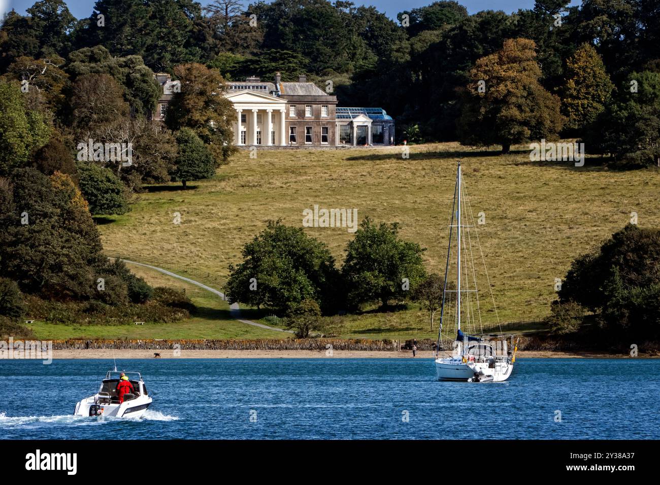 Trelissick House viewed from a boat ob the Carrick Downs Cornwall UK ...