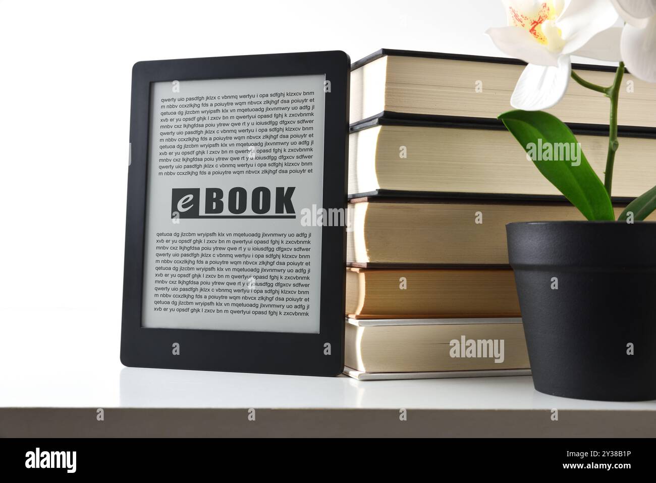 Digital reading concept with ebook on white bookshelf resting on ...