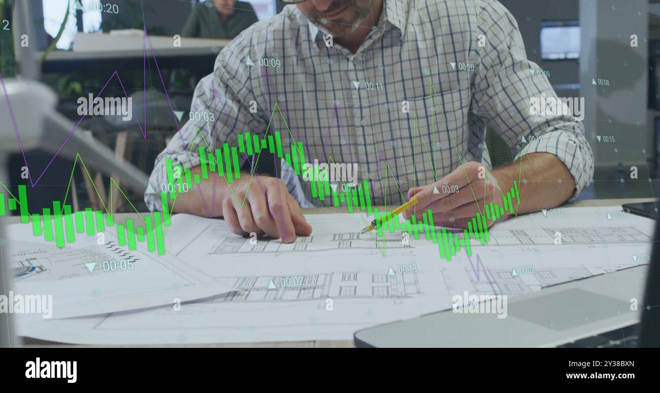Image of graph and processing data over caucasian male architect ...