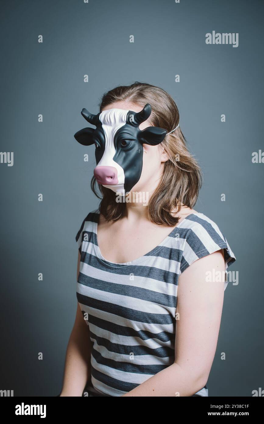 Studio, person and thinking with cow mask for character, facade and ...