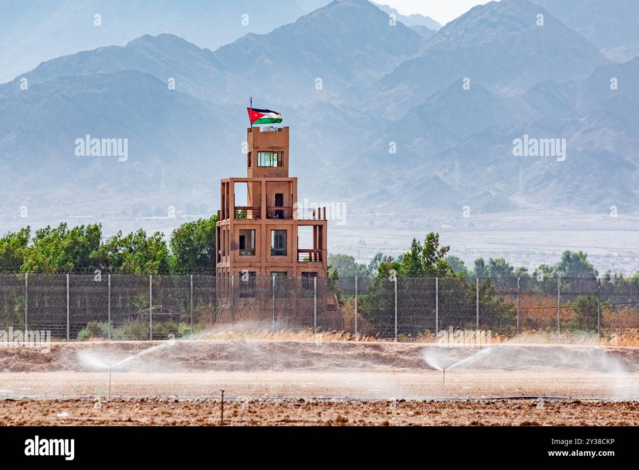 Israel and Jordan state border. Watchtower with Jordan flag in Aqaba ...