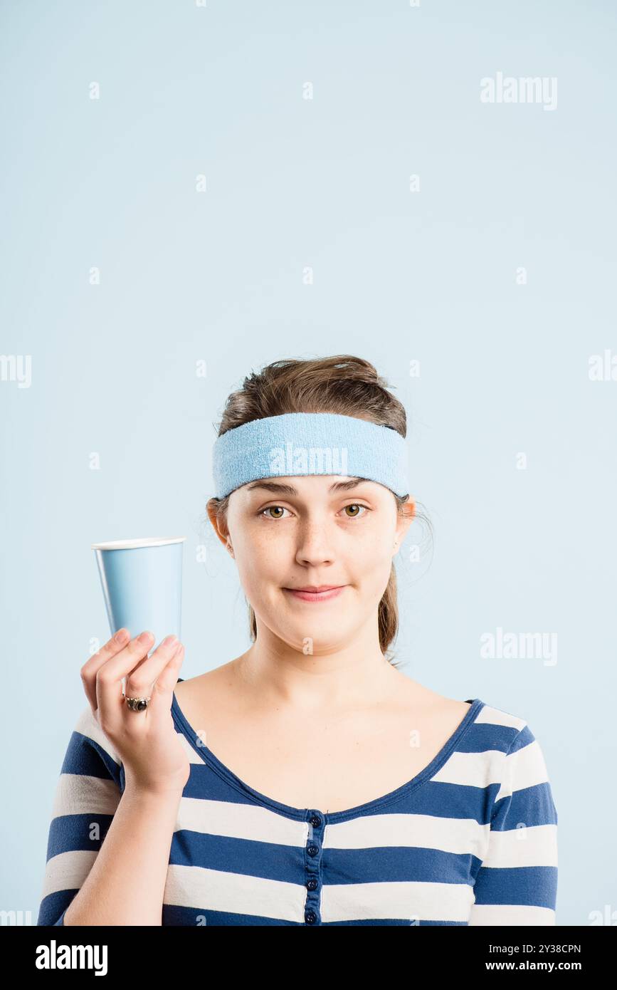 Portrait, woman and headband for fashion in studio with retro fitness ...