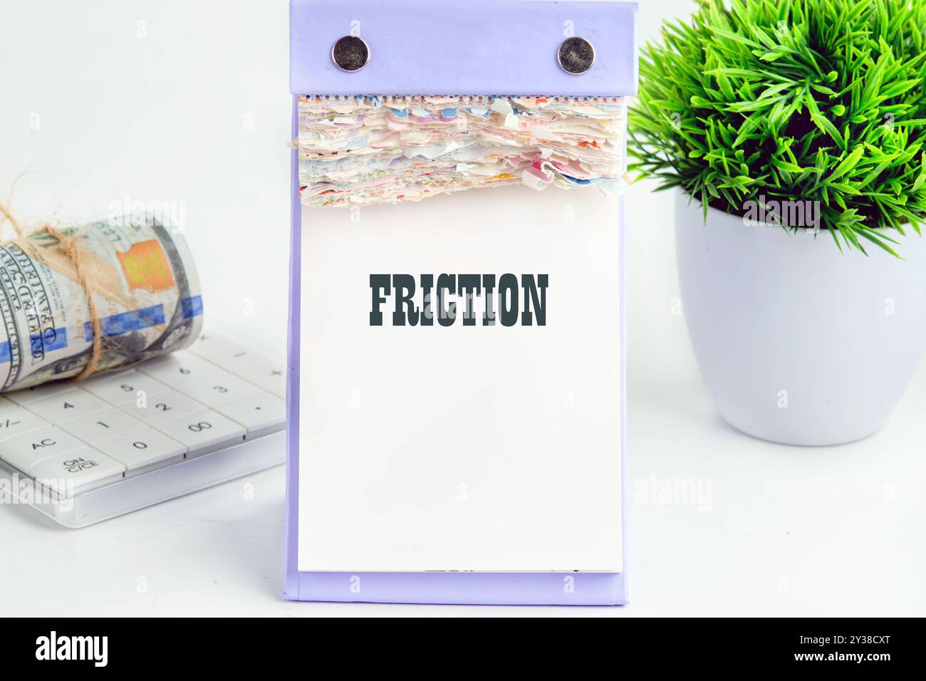 Friction concept. Friction word on a desktop calendar on a light ...