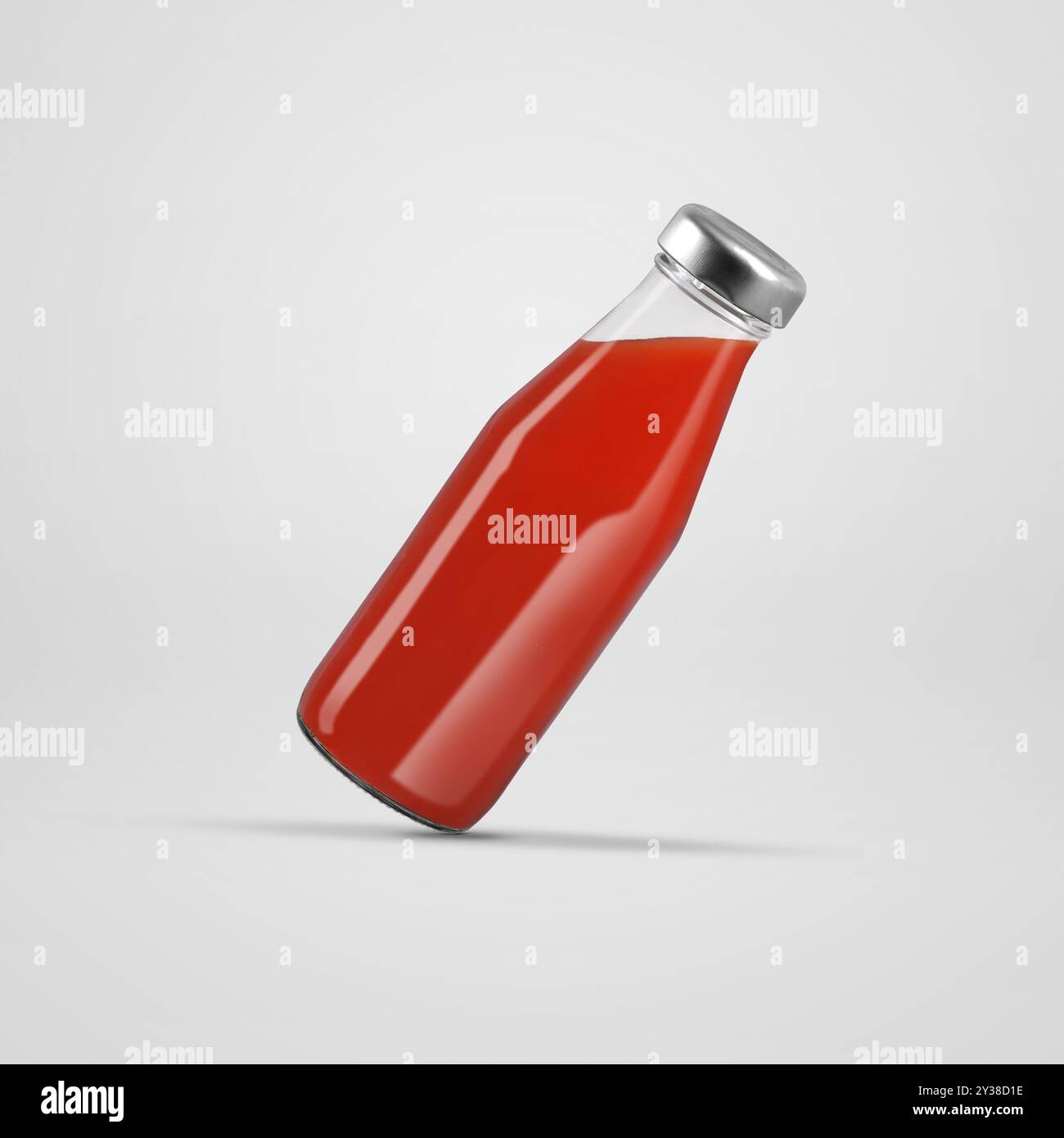 Mockup of a glass bottle with tomato juice, packaging with drink ...