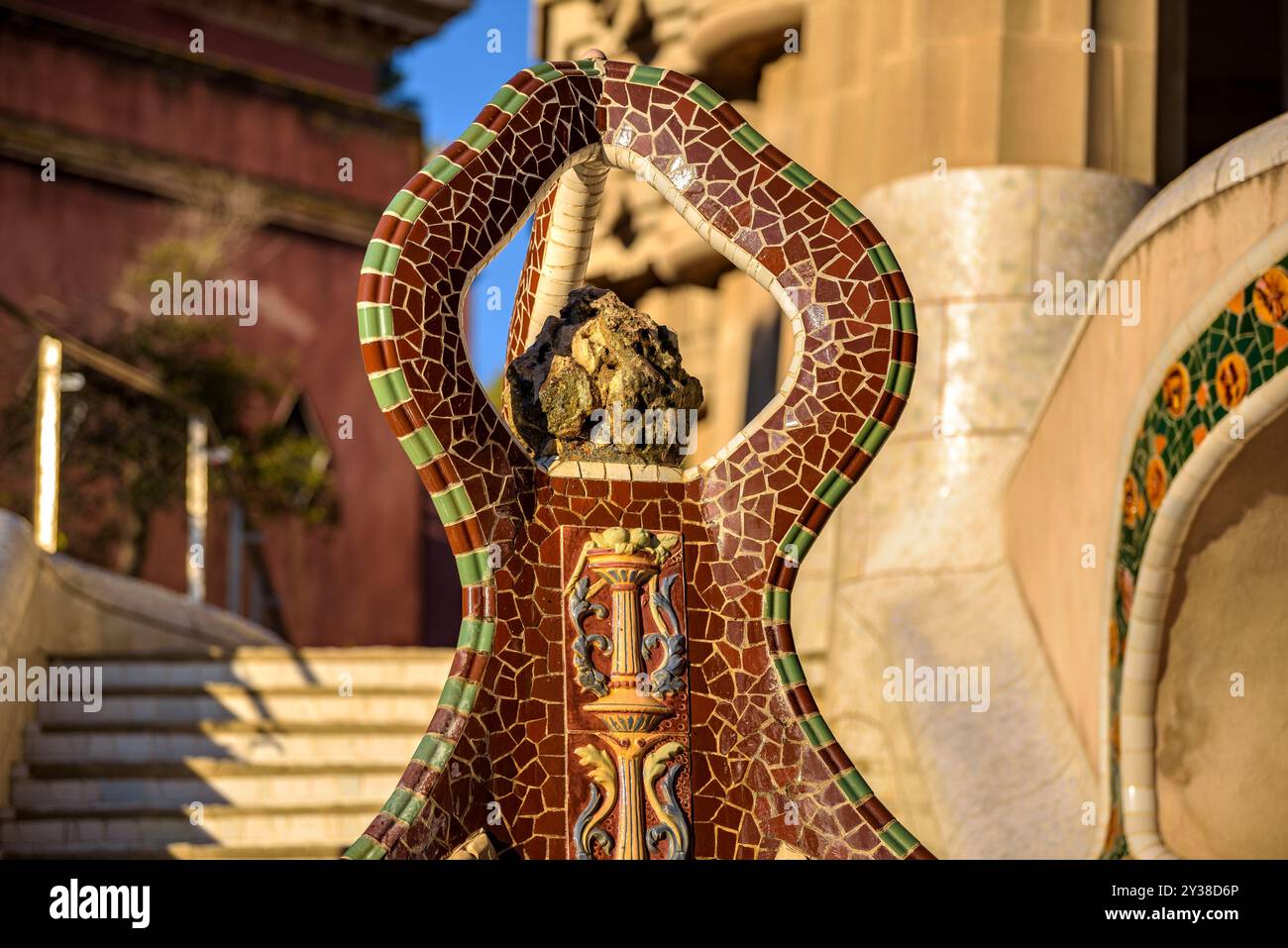 Sculpture with 'trencadís' on the dragon staircase, the entrance gate ...
