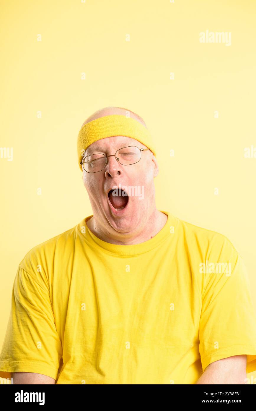 Studio, tired and man with yawning for fitness, exercise workout and ...