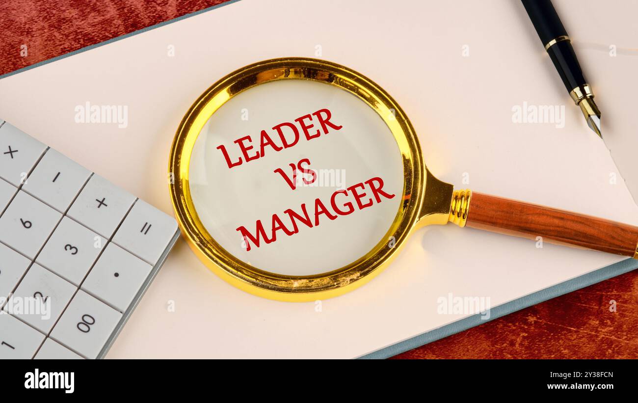 Leader vs manager is shown through a magnifying glass in red letters in ...