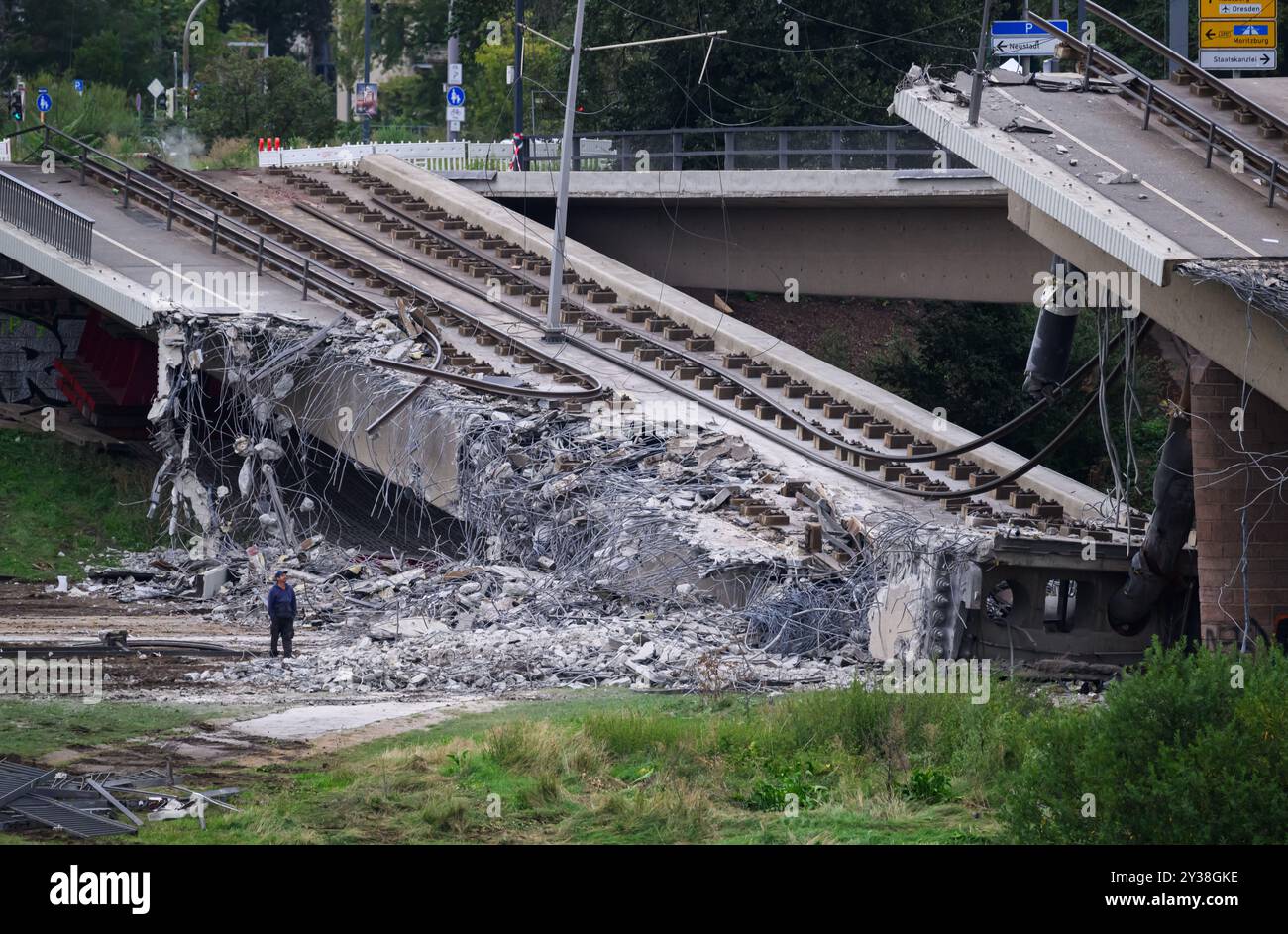 Dresden, Germany. 13th Sep, 2024. A worker stands in front of parts of ...