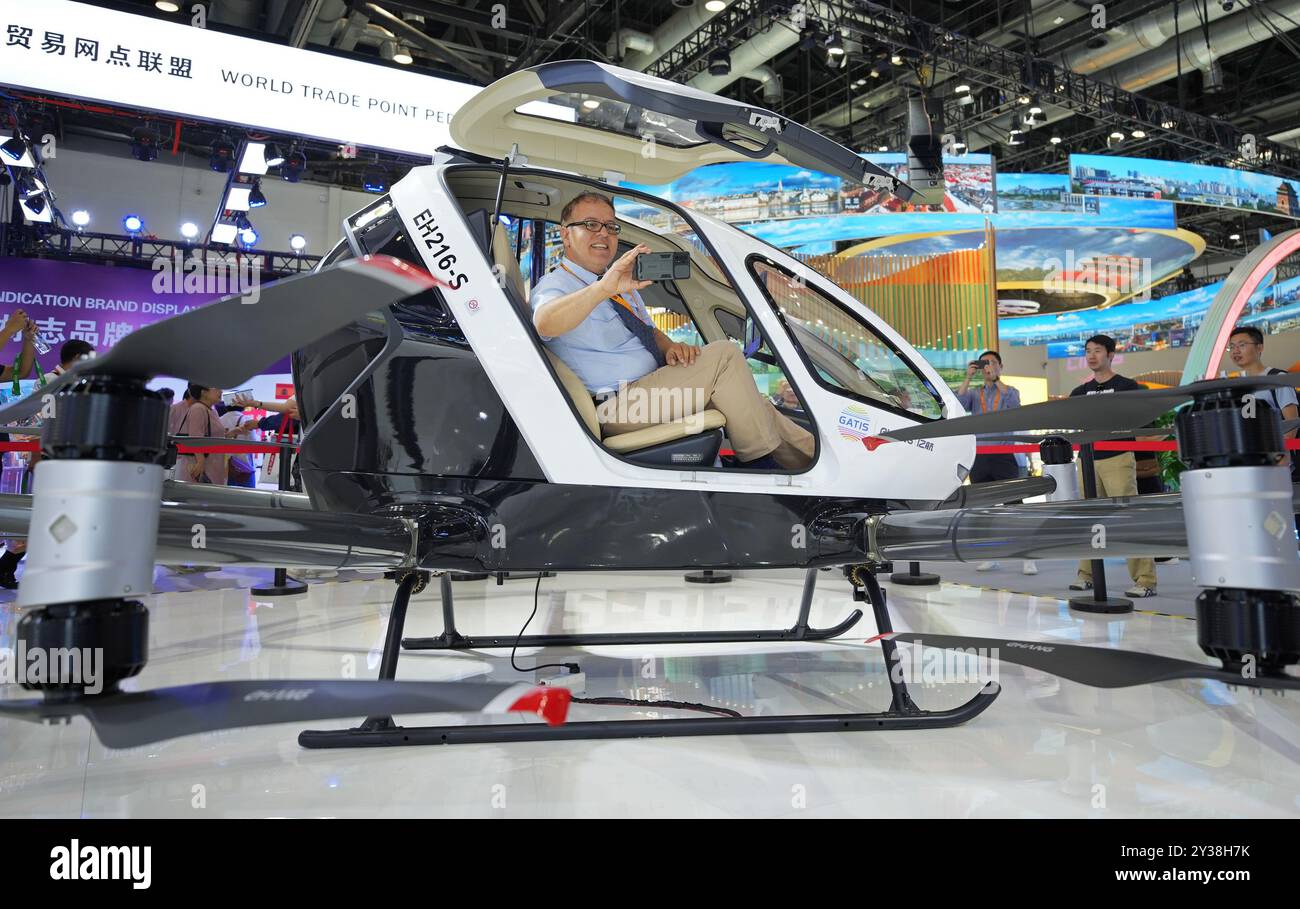 BEIJING, CHINA - SEPTEMBER 13, 2024 - Spectators experience an unmanned ...