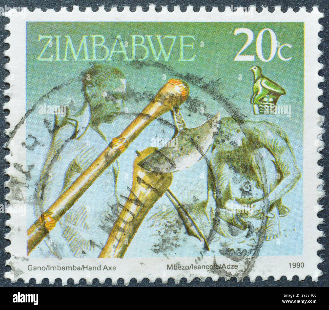 Cancelled postage stamp printed by Zimbabwe, that shows Hand axe and ...
