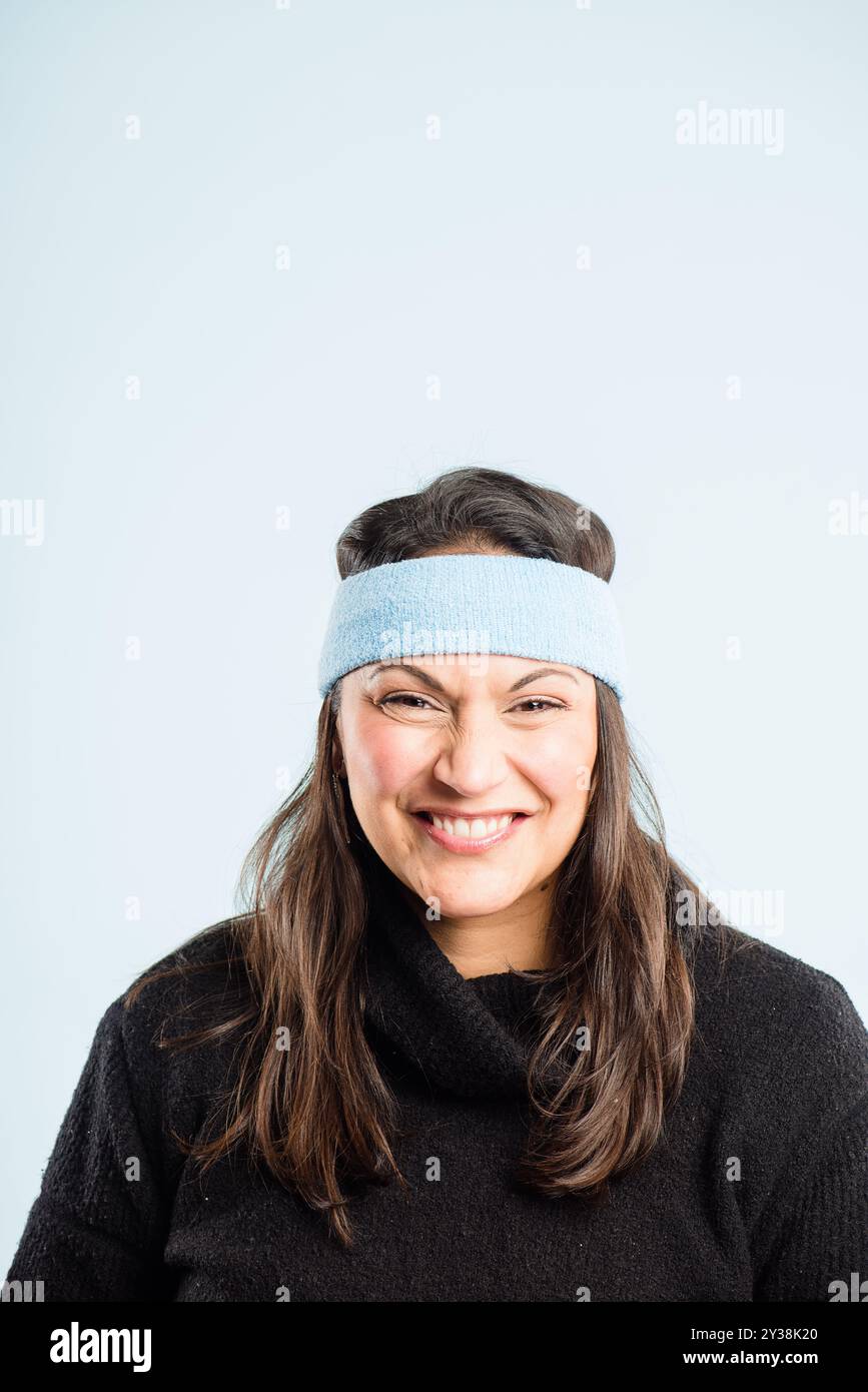 Happy, smile and face of woman in studio with funny, comic or goofy ...