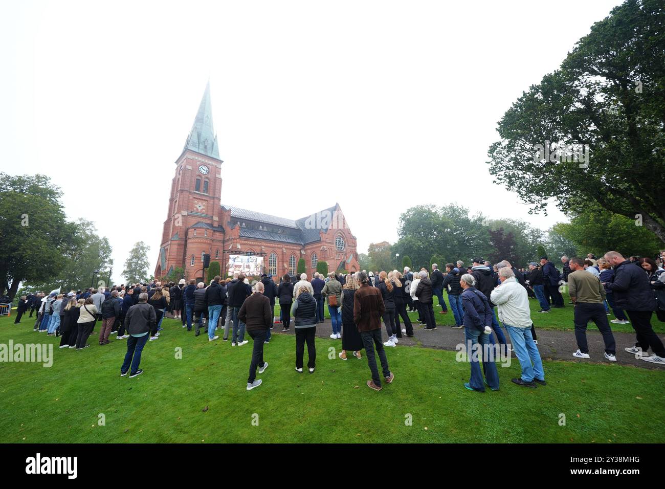 People watching on a big screen outside the funeral service of Sven ...