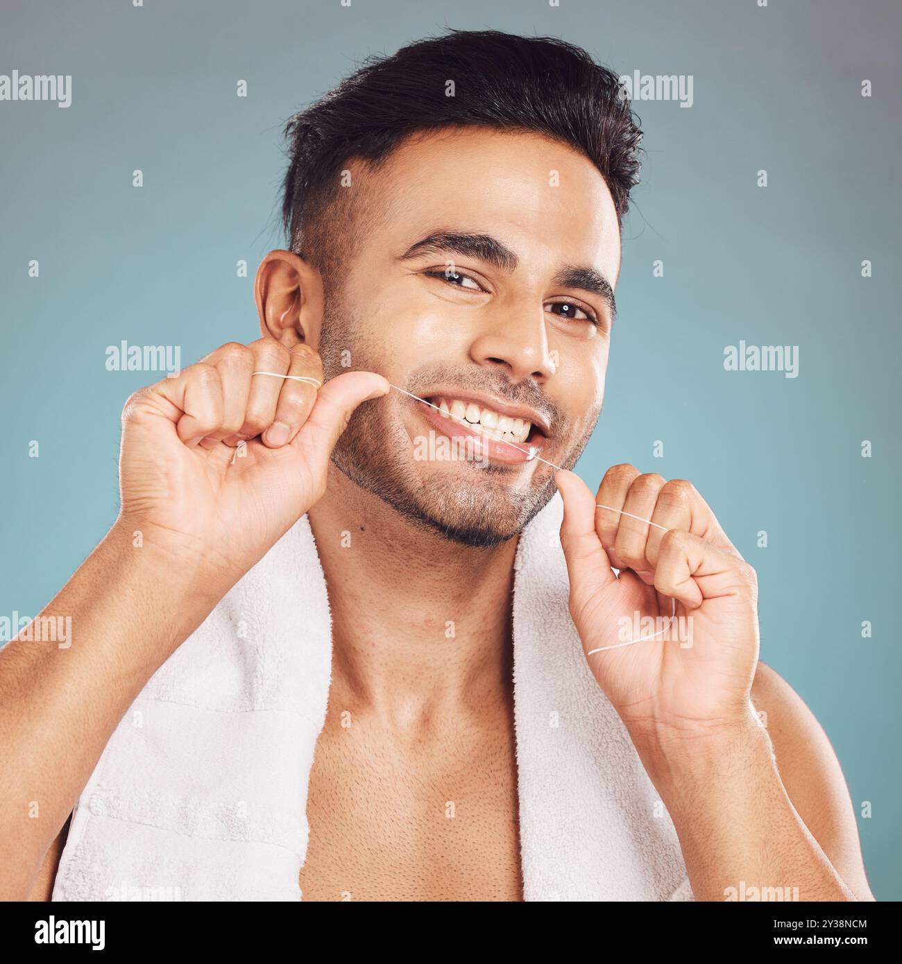 Studio, portrait and man with dental floss for hygiene, gum health and ...