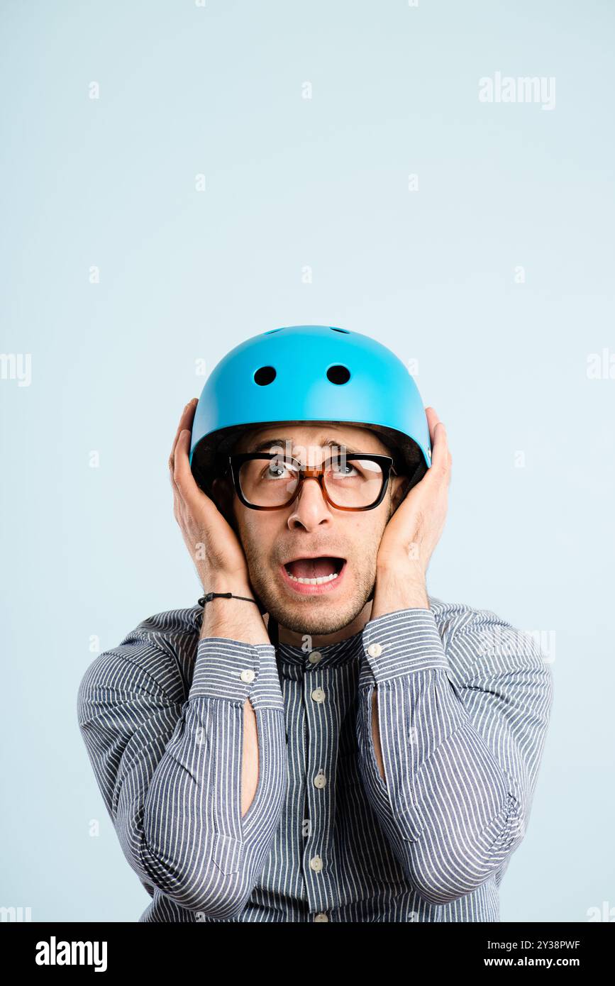 Shout, scared and businessman with helmet in studio with mockup space ...