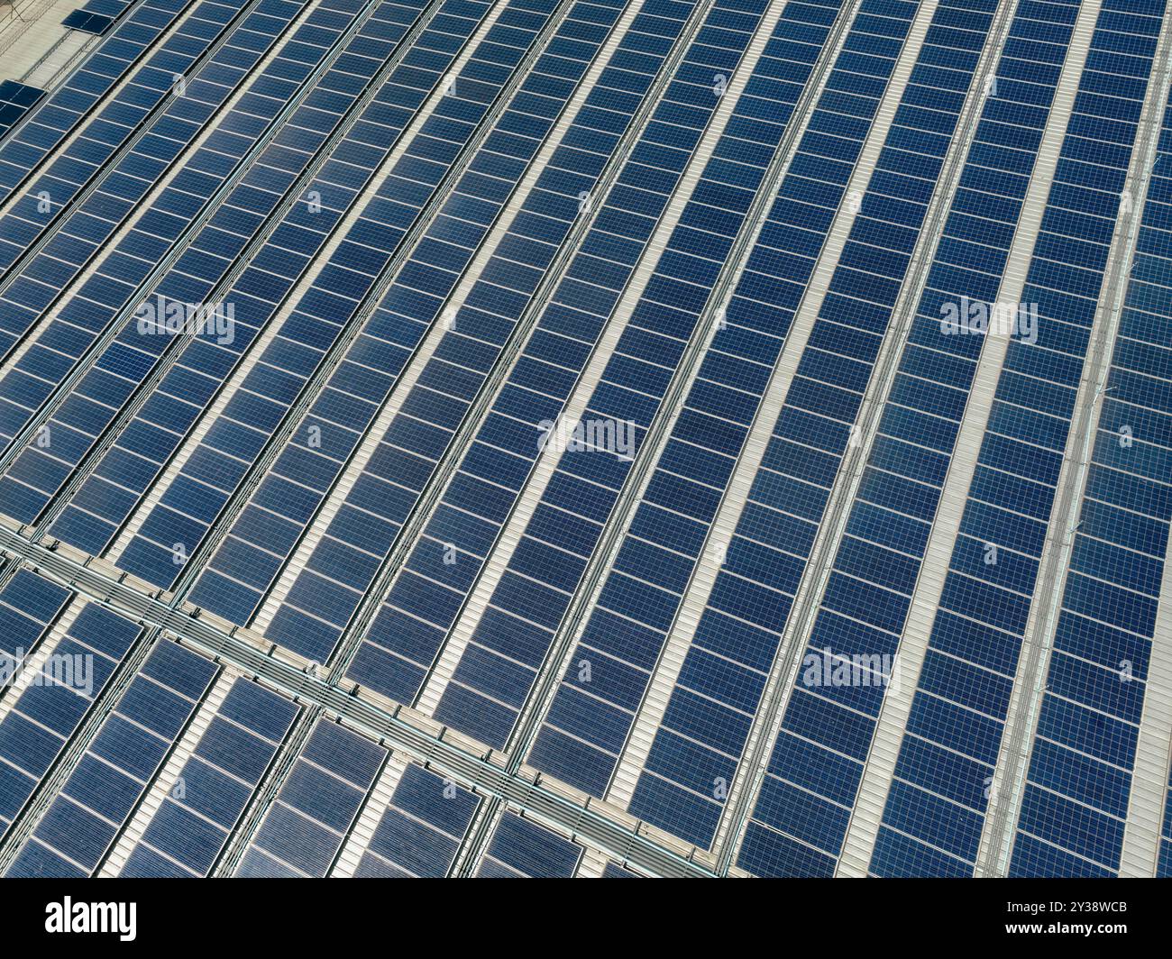 Solar energy for factory and warehouse building. Solar panels on roof ...