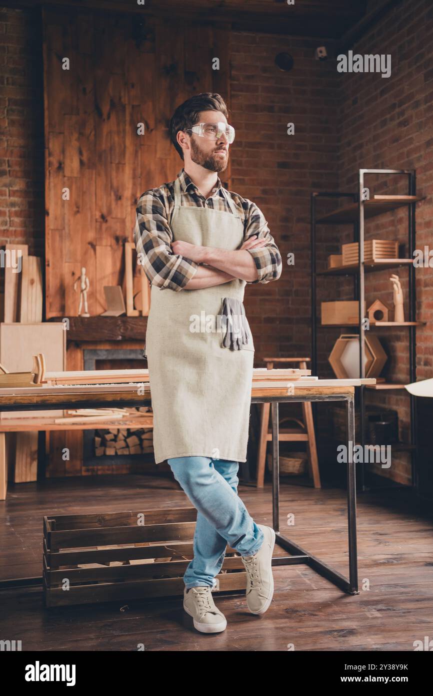 Photo of professional serious woodworker guy standing with crossed ...