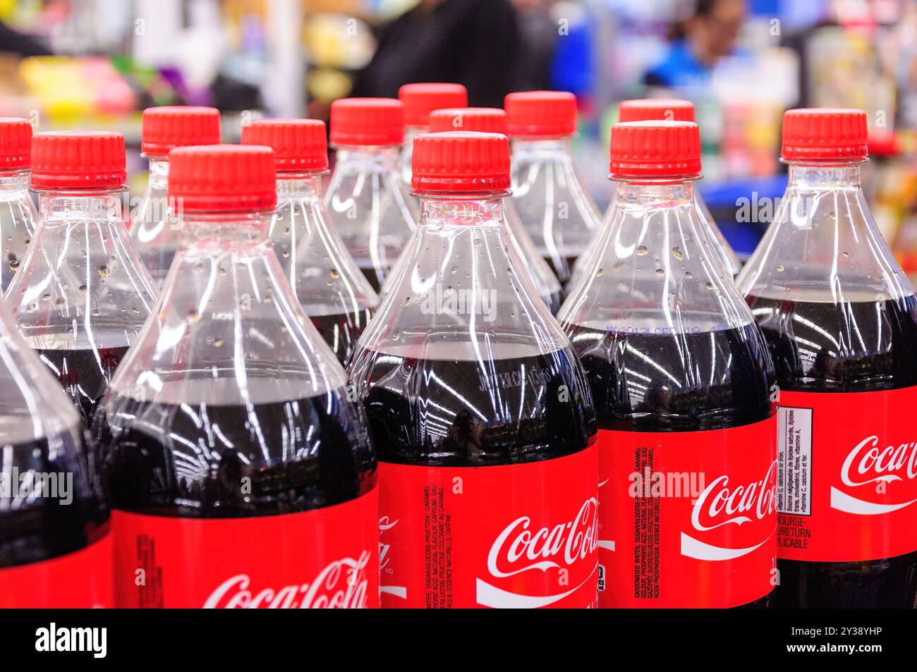 Bottles of Coca-Cola in a retail display Stock Photo - Alamy