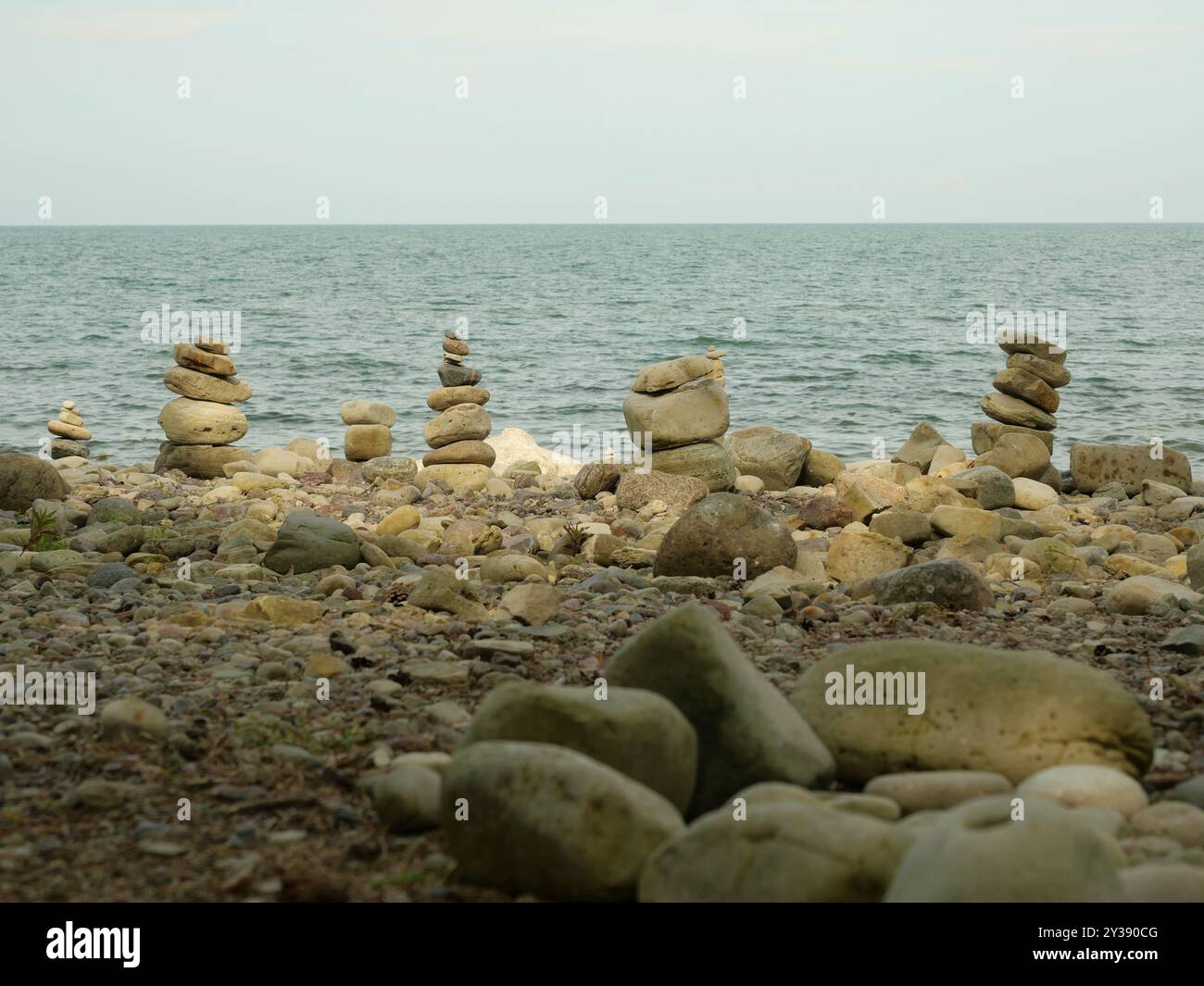 Stacked stones to form towers and figures on the beach are popular ...