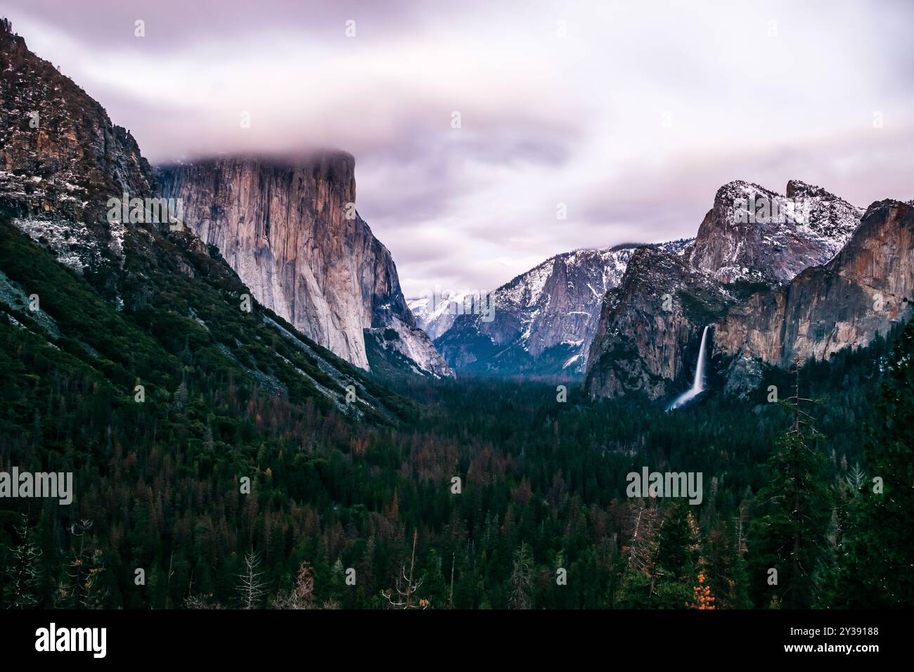 Majestic view of Yosemite Valley with towering cliffs and waterfalls ...